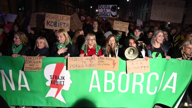Video: Women carry a banner that reads Legal abortion as they shout ...